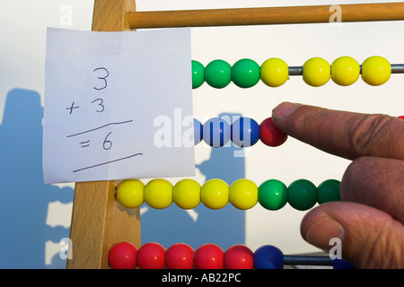 Close-up of a calculation example with abacus close-up of an addition ...