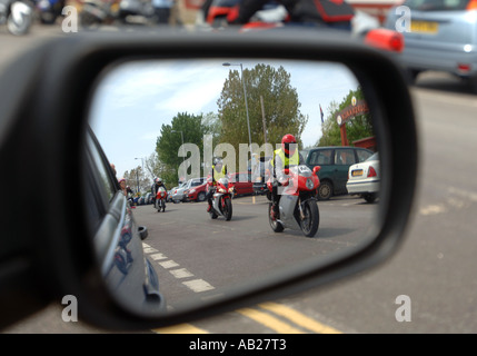 Motorcycles overtaking as seen in car rearview mirror Stock Photo - Alamy
