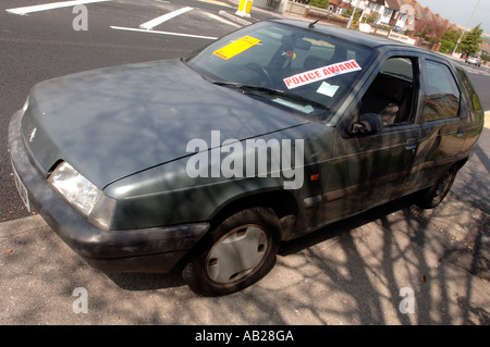Abandoned car with a Police aware notice, Britain UK Stock Photo - Alamy
