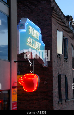 A neon coffee cup sign at Post Alley, a lane of restaurants in downtown ...