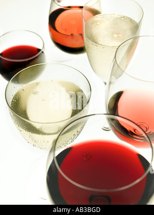 Wines assortment. Red, white, rose wine in wineglasses and bottles on ...