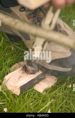 making fire the traditional way using friction Stock Photo - Alamy