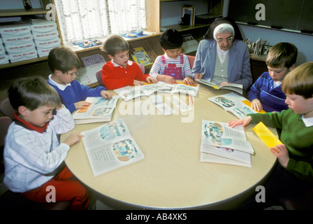 A teacher (Catholic nun) teaches students in a classroom at the St ...