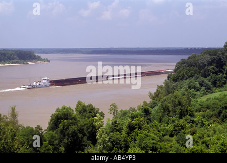 Tug boats pushes barges through a water lock system on the Ohio river ...