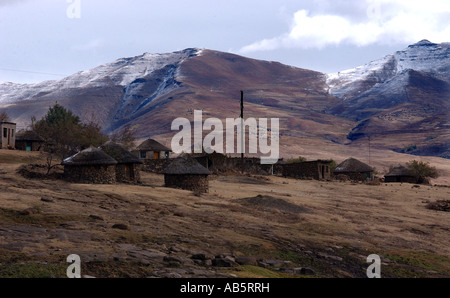 Basotho huts and mountains in the Southern African mountain kingdom ...