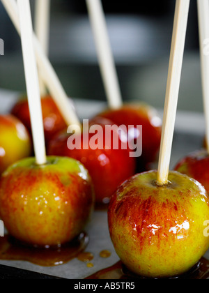 home made toffee apples drying on greese proof paper Stock Photo - Alamy