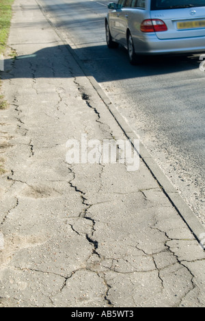 Cracked dangerous paving pavement path health and safety. Broken ...