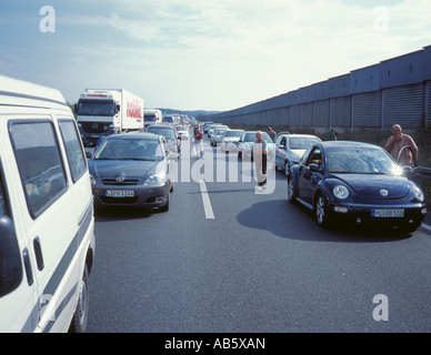 Fatal traffic accident on Autobahn, firefighters covering dead person ...