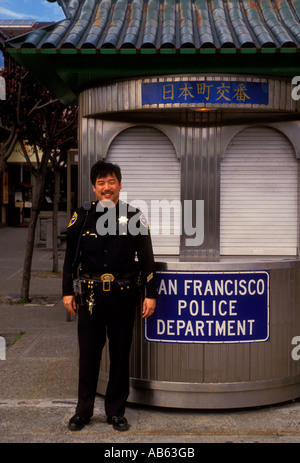 Friendly Asian police officer smiling London Stock Photo - Alamy