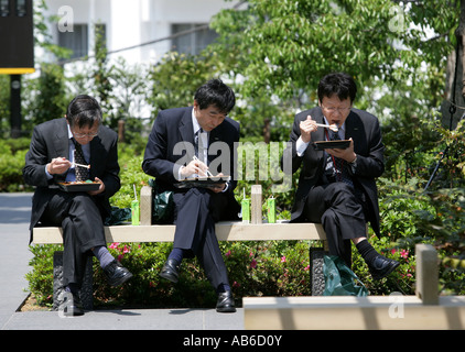 JPN, Japan, Tokyo: Office worker at lunch break in Tokyo Midtown Garden ...