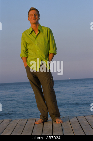 man standing on a pier Stock Photo - Alamy