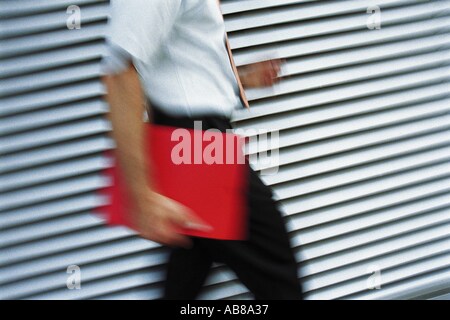 Man carrying file Stock Photo - Alamy