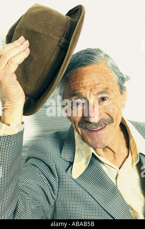 Old man taking his hat off Stock Photo - Alamy
