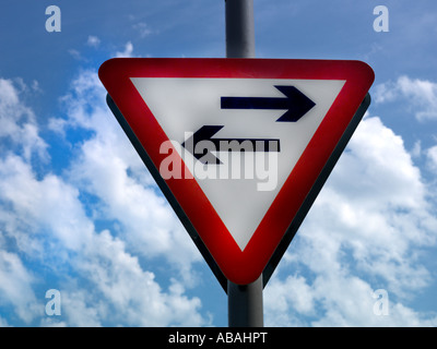 Road sign with two arrows pointing down to opposite sides Stock Photo ...