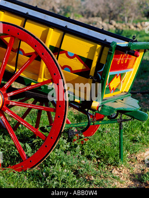 Portugal, the Algarve, rustic painted cart outside farmhouse Stock ...