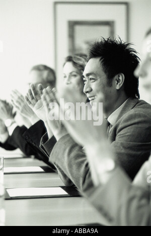 Businesspeople applauding while in a meeting Stock Photo - Alamy
