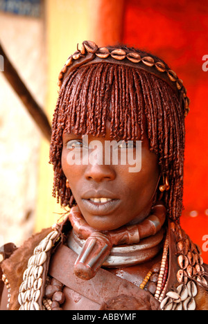 Portrait woman of the Hamar people wears a leather cloth and typical ...