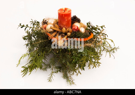 Red advent flower arrangement with burning candles Stock Photo - Alamy