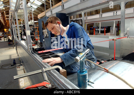 Assembly worker at bus and coach manufacturing company East Stock Photo ...