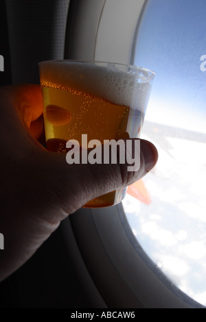Drinking alcohol onboard during an airplane flight Stock Photo - Alamy