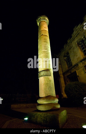 Tall sign post pointing directions to cities and towns around Cook ...