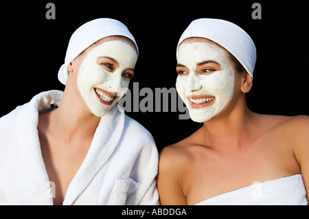 Two women wearing face masks walk past Marble Arch, London, towards ...