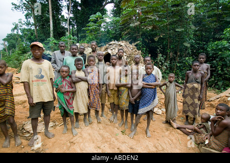 A Baka pygmy family by their temporary leaf houses in the rainforest of ...