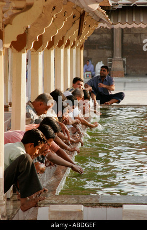 Muslims washing before prayer at the Jami Masjid Mosque in Delhi India ...