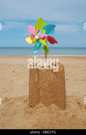 sandcastle and windmill on beach kent Stock Photo - Alamy