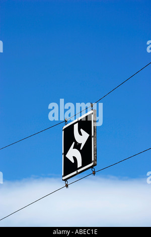 Road sign with two curved arrows pointing in opposite directions Stock ...