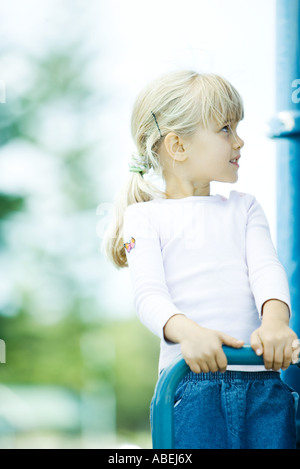 Kid with ponytails colors. Girl with smiling face stands Stock Photo ...