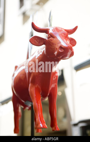 Red Swiss cow statue Stock Photo - Alamy