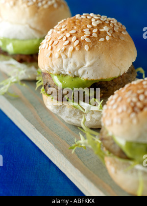 Burger mini burgers snacks on a wooden table with craft paper ...