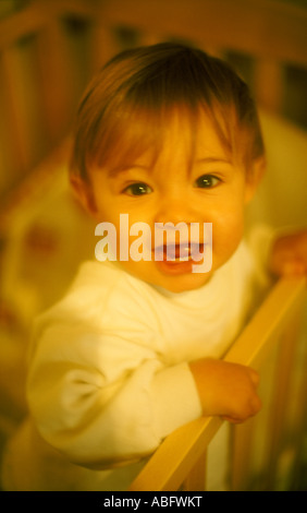 a baby inside a crib Stock Photo - Alamy