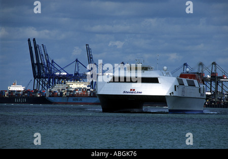 Stena Line HSS Discovery passenger ferry passing a container ship in ...