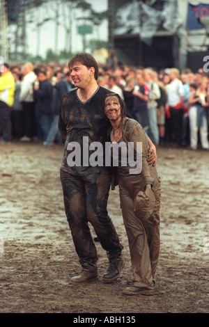 Pop fan covered in the mud at a music festival UK Stock Photo - Alamy