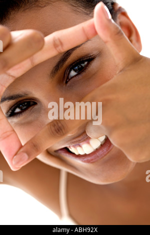 Woman making a frame with her fingers Stock Photo - Alamy