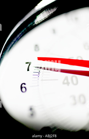 Needle pointing to weight on dial of weighing scale Stock Photo - Alamy