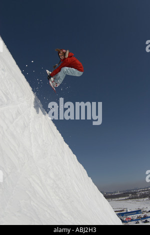 Snowboard girl and half pipe ride 9 Stock Photo - Alamy
