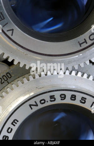 Two gears meshing together Stock Photo - Alamy