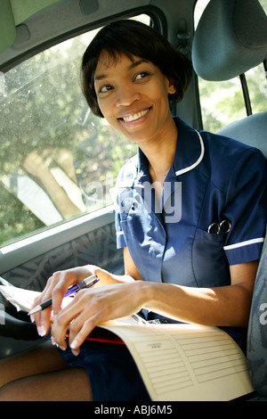 District nurse sat in car Stock Photo: 48101540 - Alamy