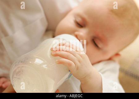Baby being fed Stock Photo - Alamy