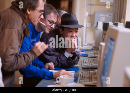 Internet cafe London UK 1990s. Customers in cafe computer terminals ...