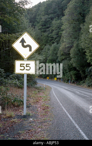 Sharp right hand bend sign on a country road in UK Stock Photo - Alamy
