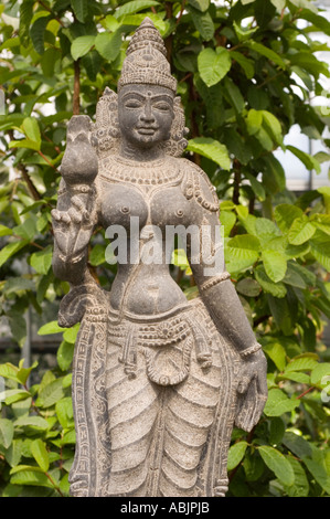 Stone statue of standing Hindu female God Parvati Stock Photo - Alamy