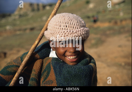 A Basotho shepherd in the traditional blanket up in the highlands of ...