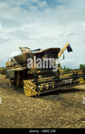 Combine harvester destroyed by fire Stock Photo - Alamy
