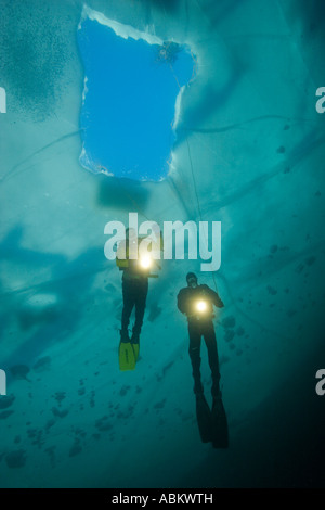 scuba diver with safety rope at an ice hole Stock Photo - Alamy