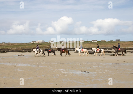 Horse riders on Omey strand Connemara Ireland Stock Photo - Alamy