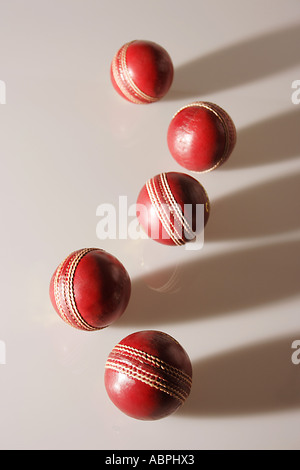 Cricket balls five maroon color Stock Photo - Alamy